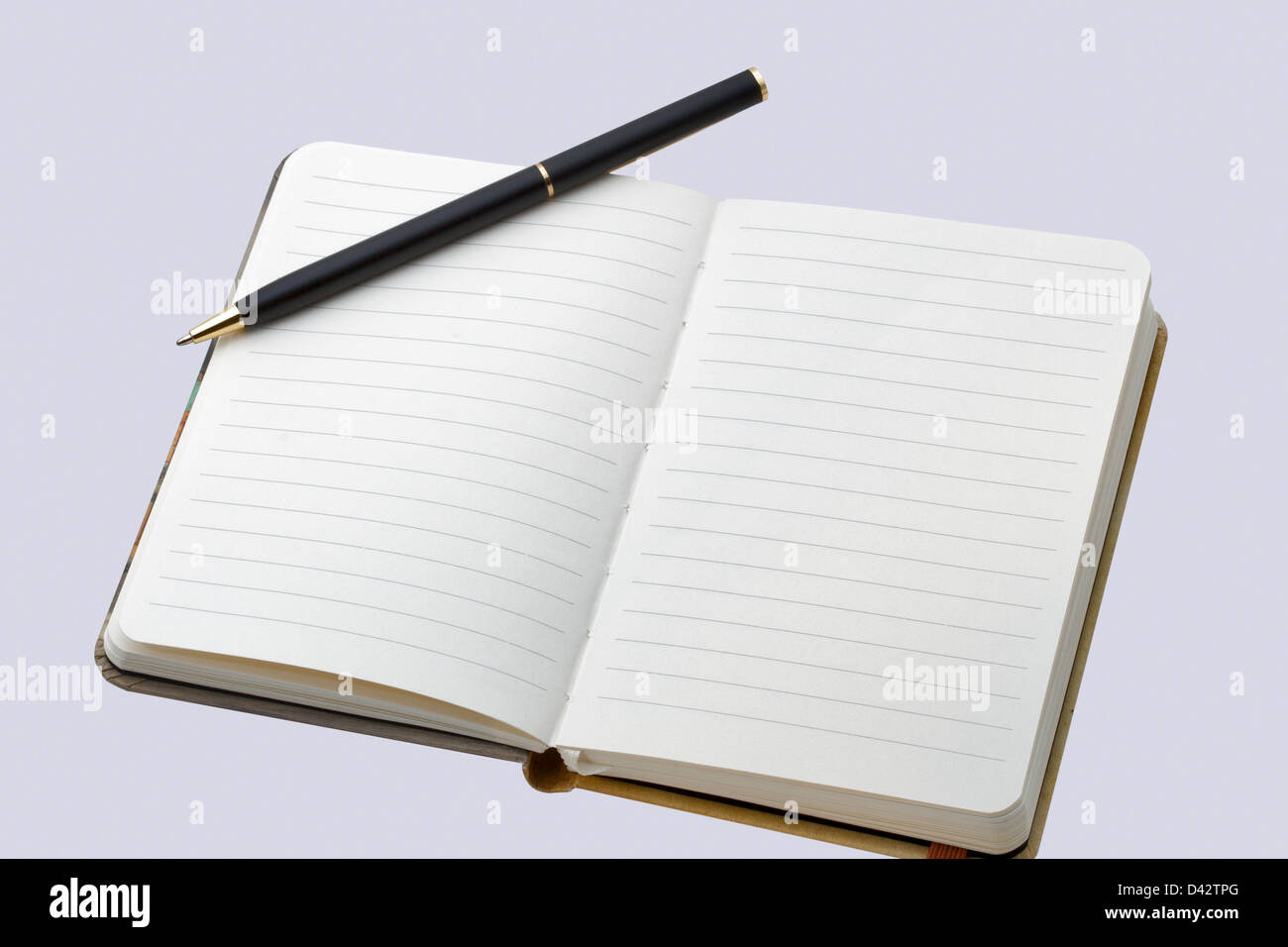 Fountain pen on opened book isolated on white Stock Photo - Alamy