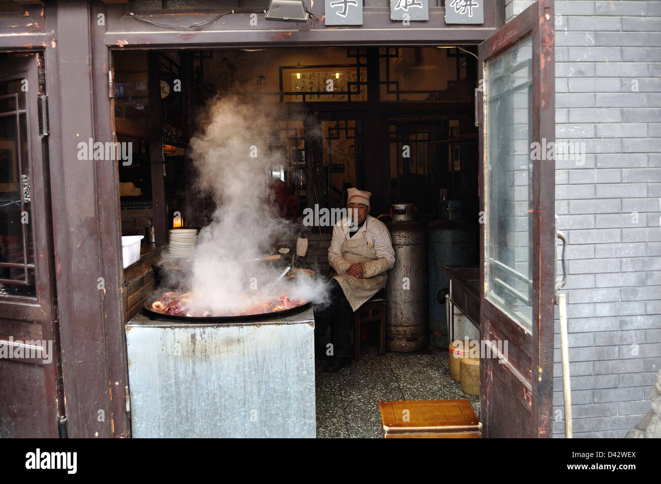 cook in Chinese restaurant Stock Photo - Alamy