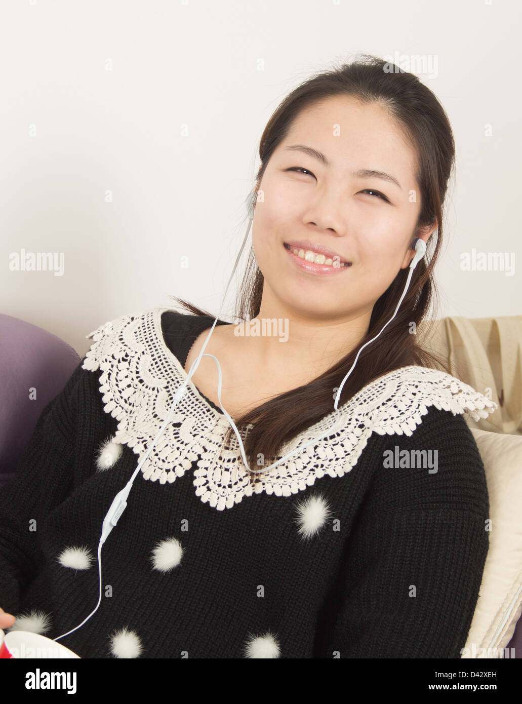 Happy woman listening to music Stock Photo - Alamy