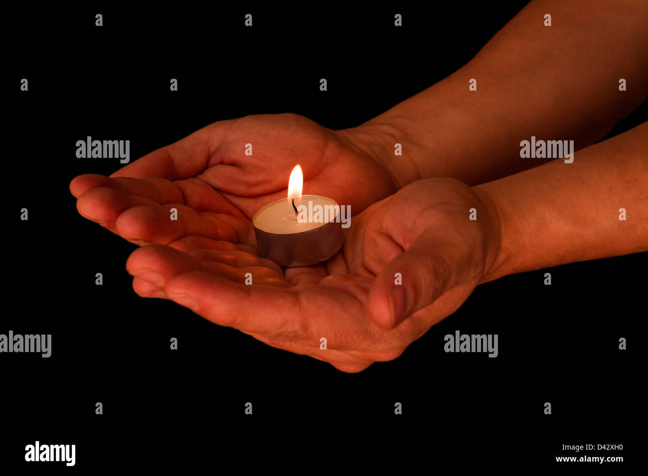 Hands candle flame hi-res stock photography and images - Alamy