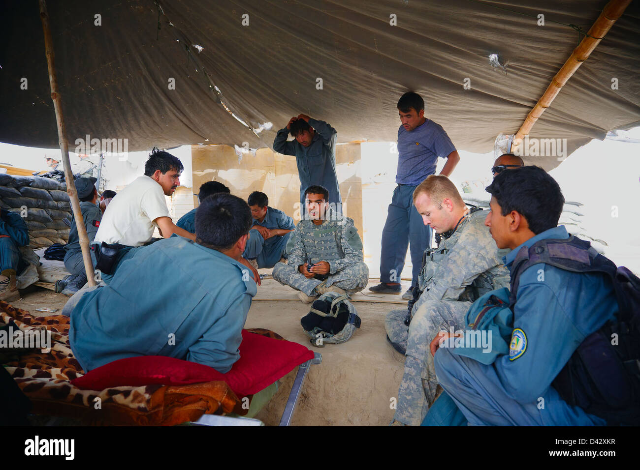 International Security Assistance Force soldiers discuss a recent ...