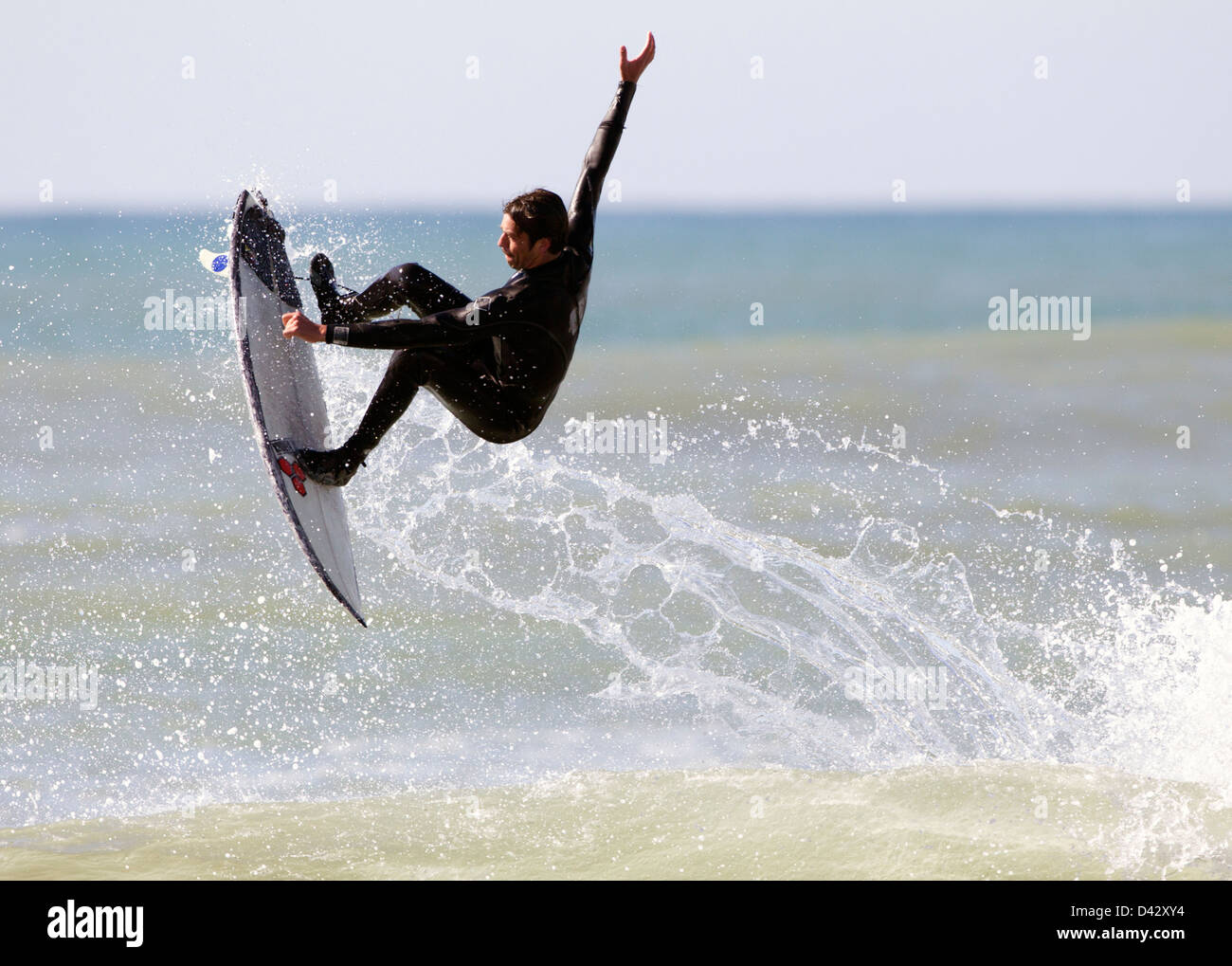 Male surfer doing cool tricks hi-res stock photography and images - Alamy