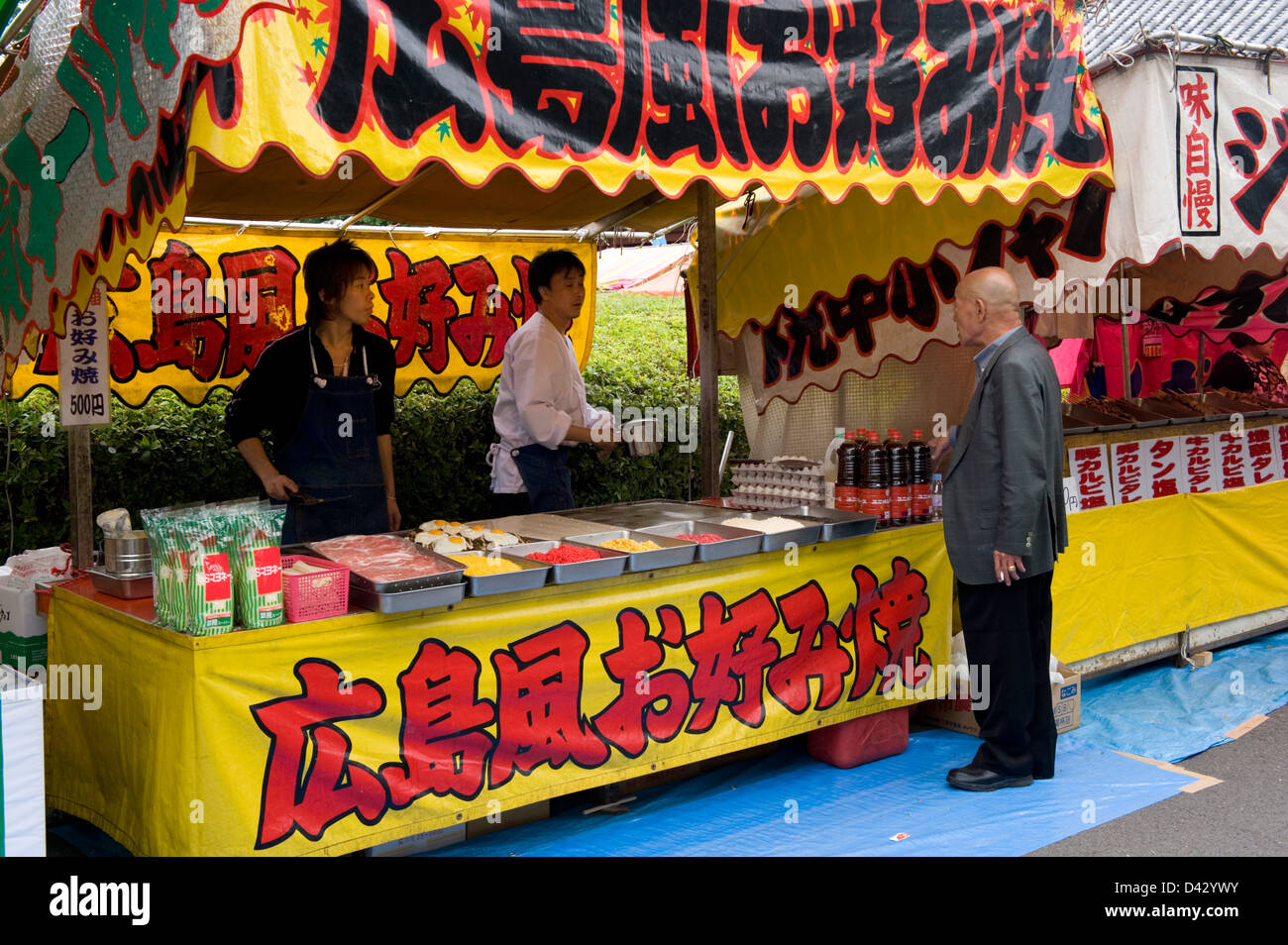 Roten stand is selling famous Hiroshima okonomiyaki, a Japanese pizza ...