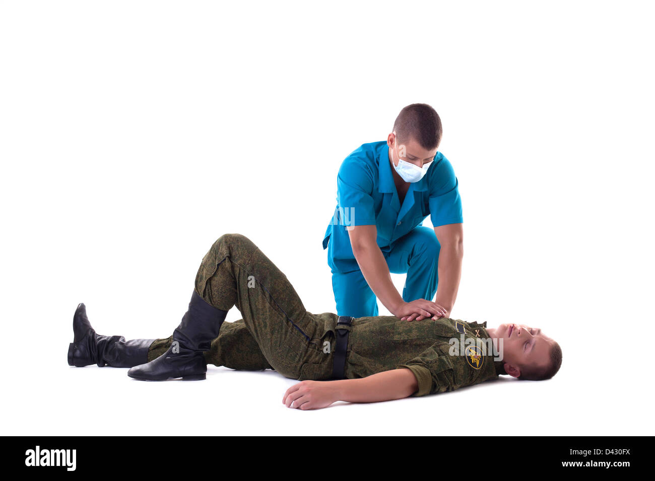 Rescuer makes first aid for soldier Stock Photo - Alamy