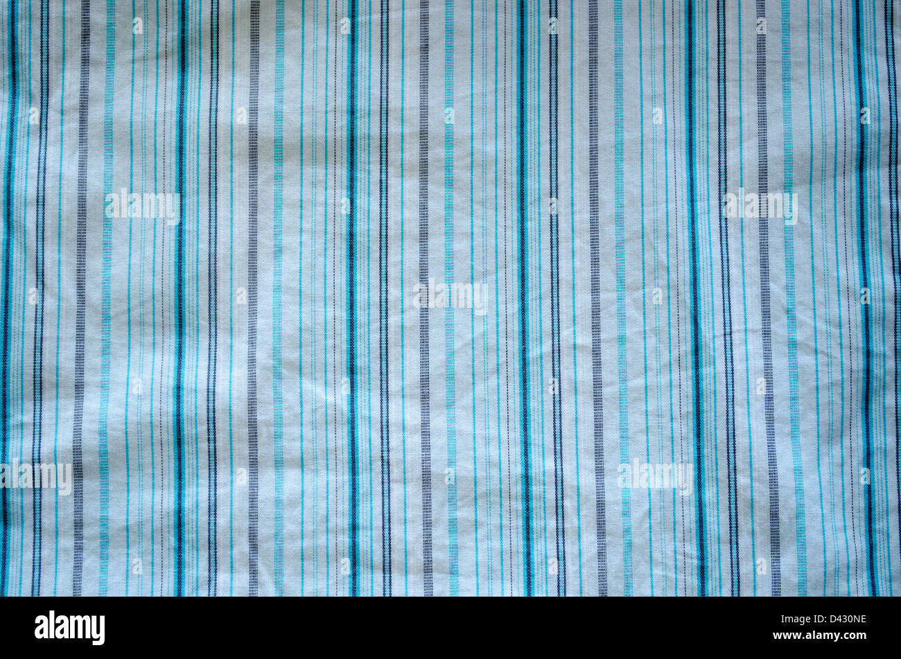 crumple fabric with blue and gray lines on white background closeup ...