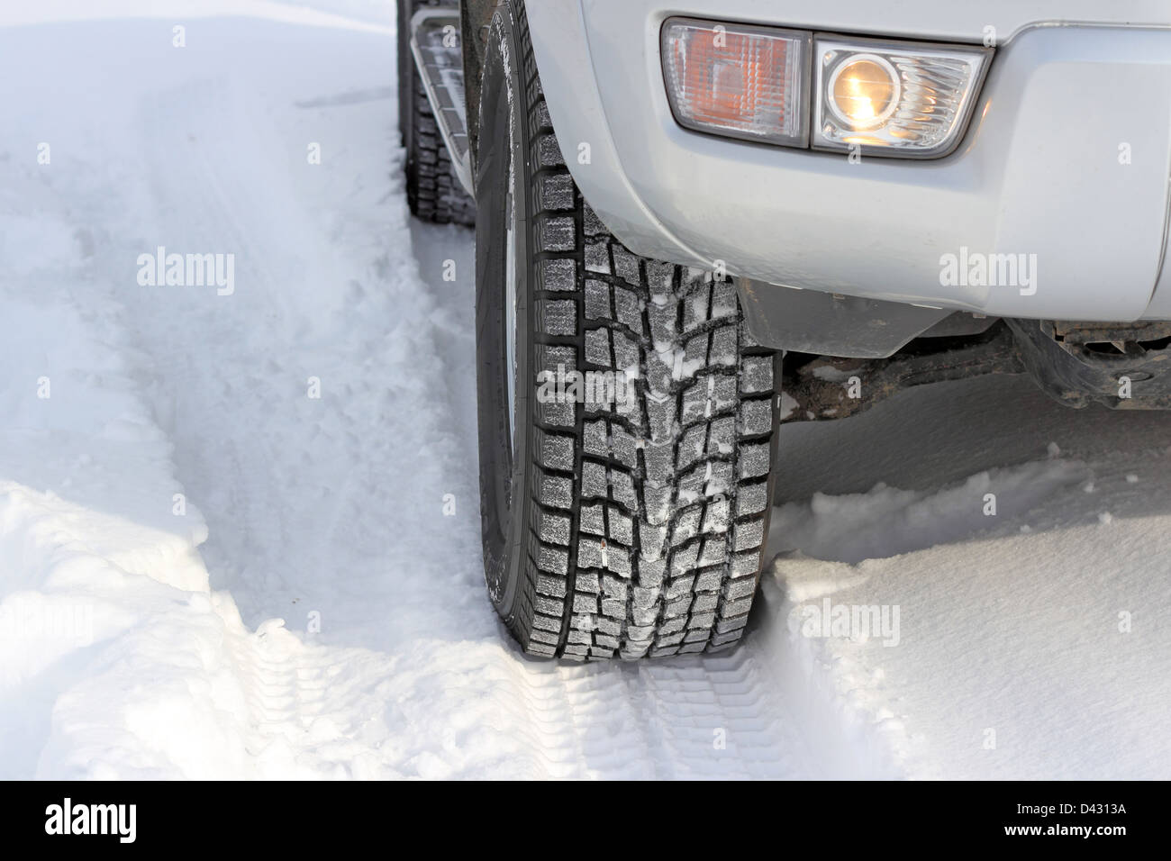 Snowy winter road ahead an unrecognizable car Stock Photo - Alamy