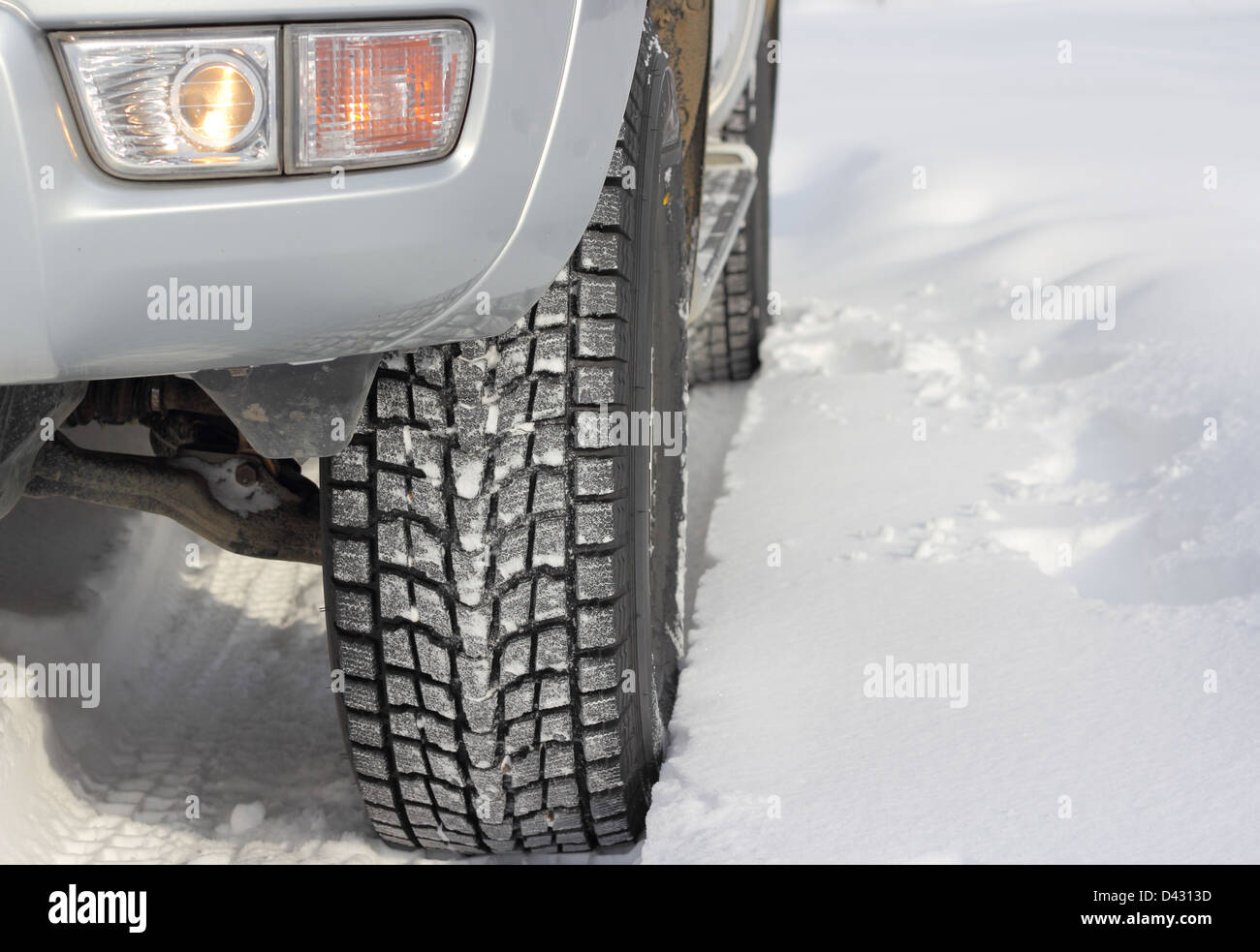 Snowy winter road ahead an unrecognizable car Stock Photo - Alamy