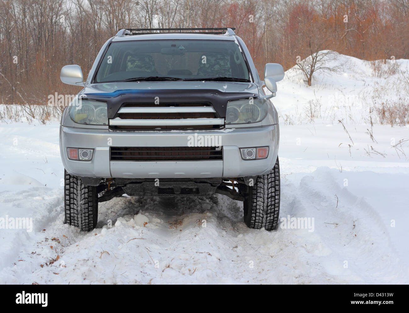 Snowy winter road ahead an unrecognizable car Stock Photo - Alamy