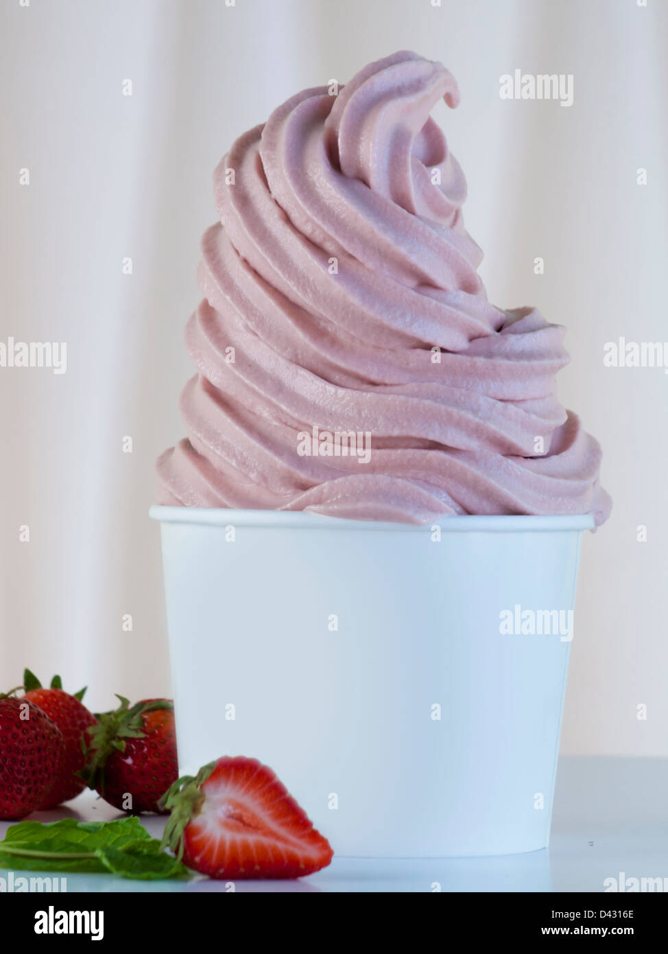 Cup of strawberry frozen yogurt or soft serve ice cream with fresh fruit Stock Photo - Alamy