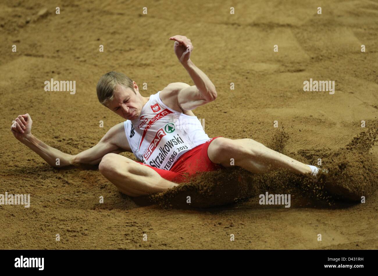 Adrian Strzalkowski of Poland competes in the men's long jump ...