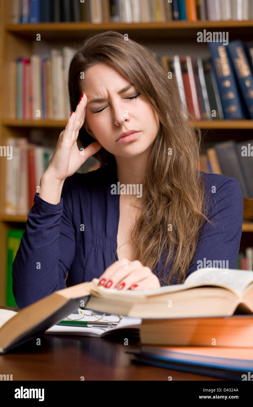 Portrait of stressed out looking beautiful young student woman Stock ...