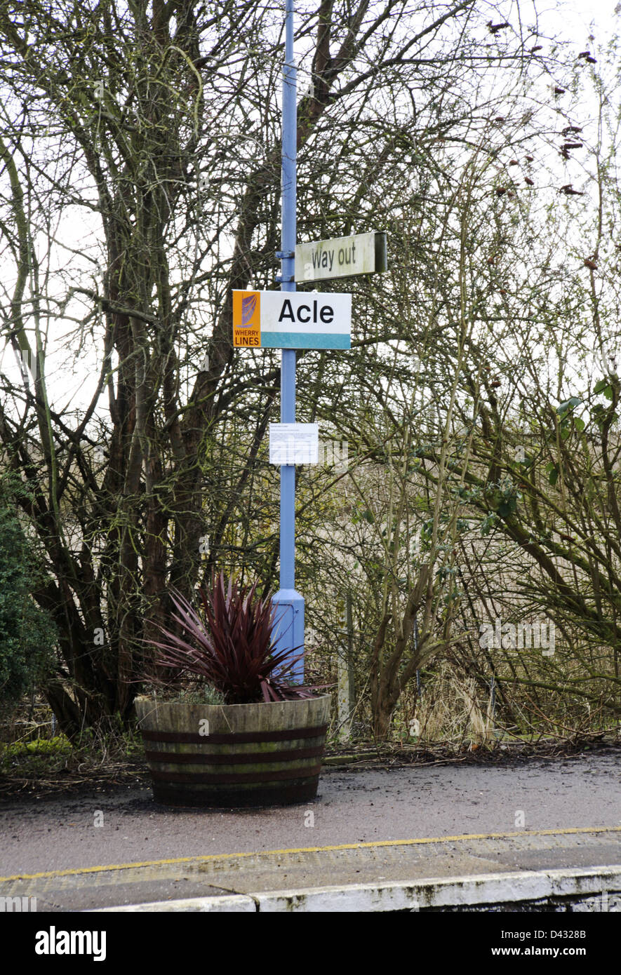 A lamp post with signs on a platform at the railway station at Acle ...
