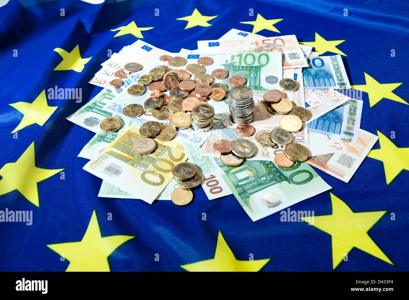 Hamburg, Germany, Euro notes and Euromuenzen on a European flag Stock ...