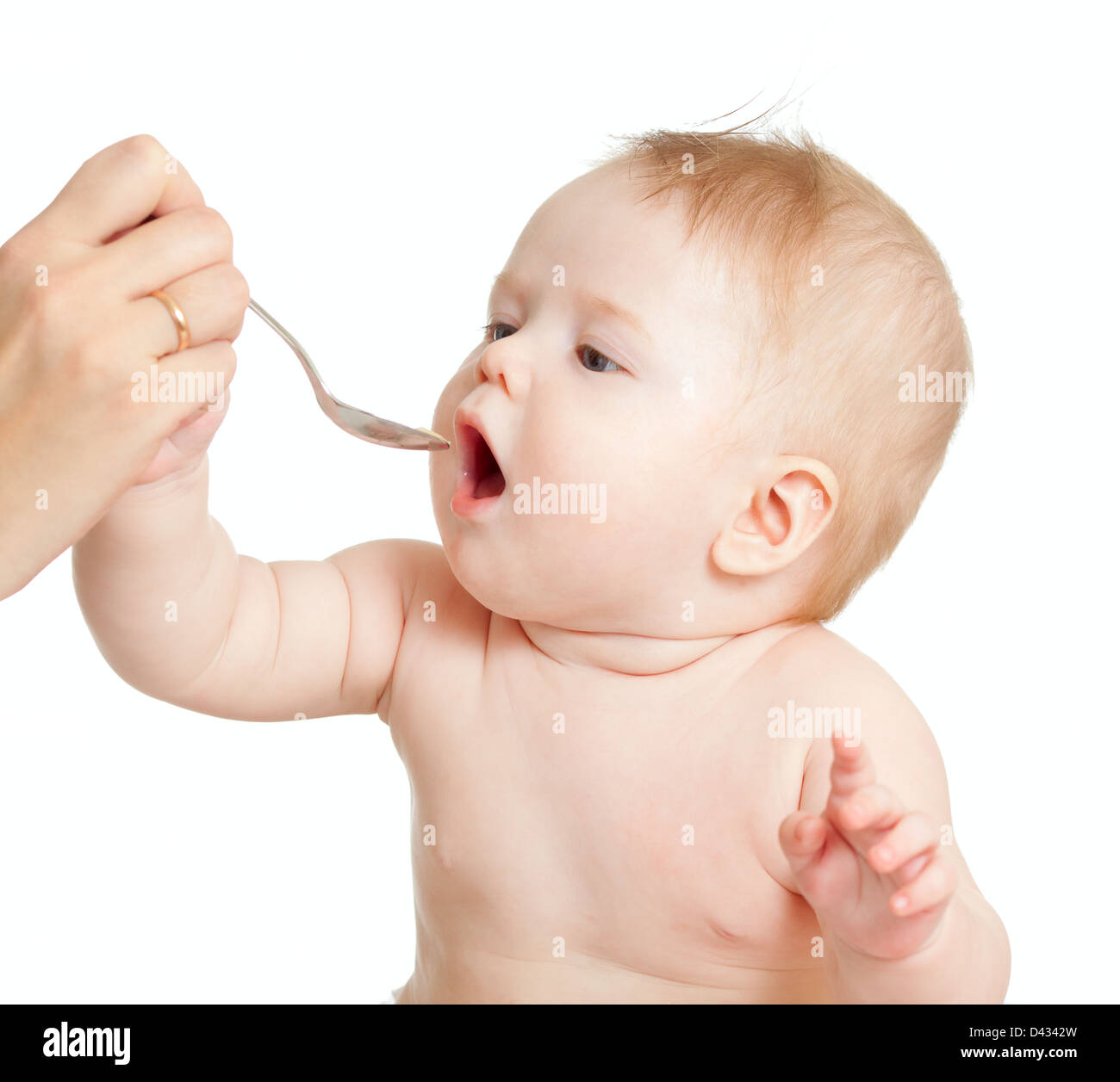 Little baby feeding with a spoon Stock Photo - Alamy
