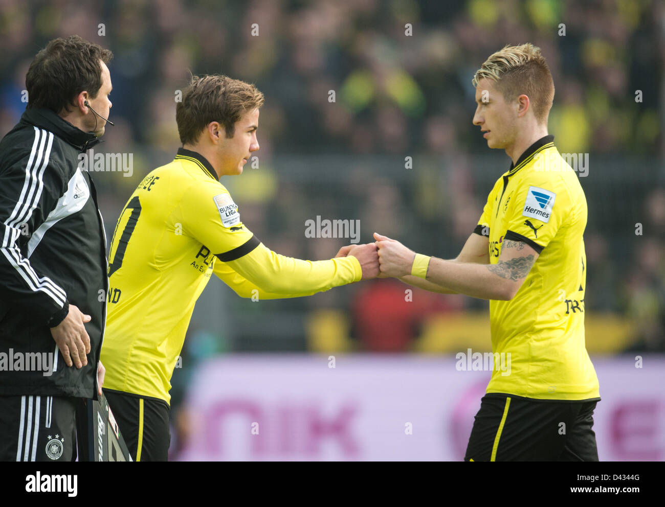 Dortmund's Mario Goetze (L) is substituted for Marco Reus during the ...