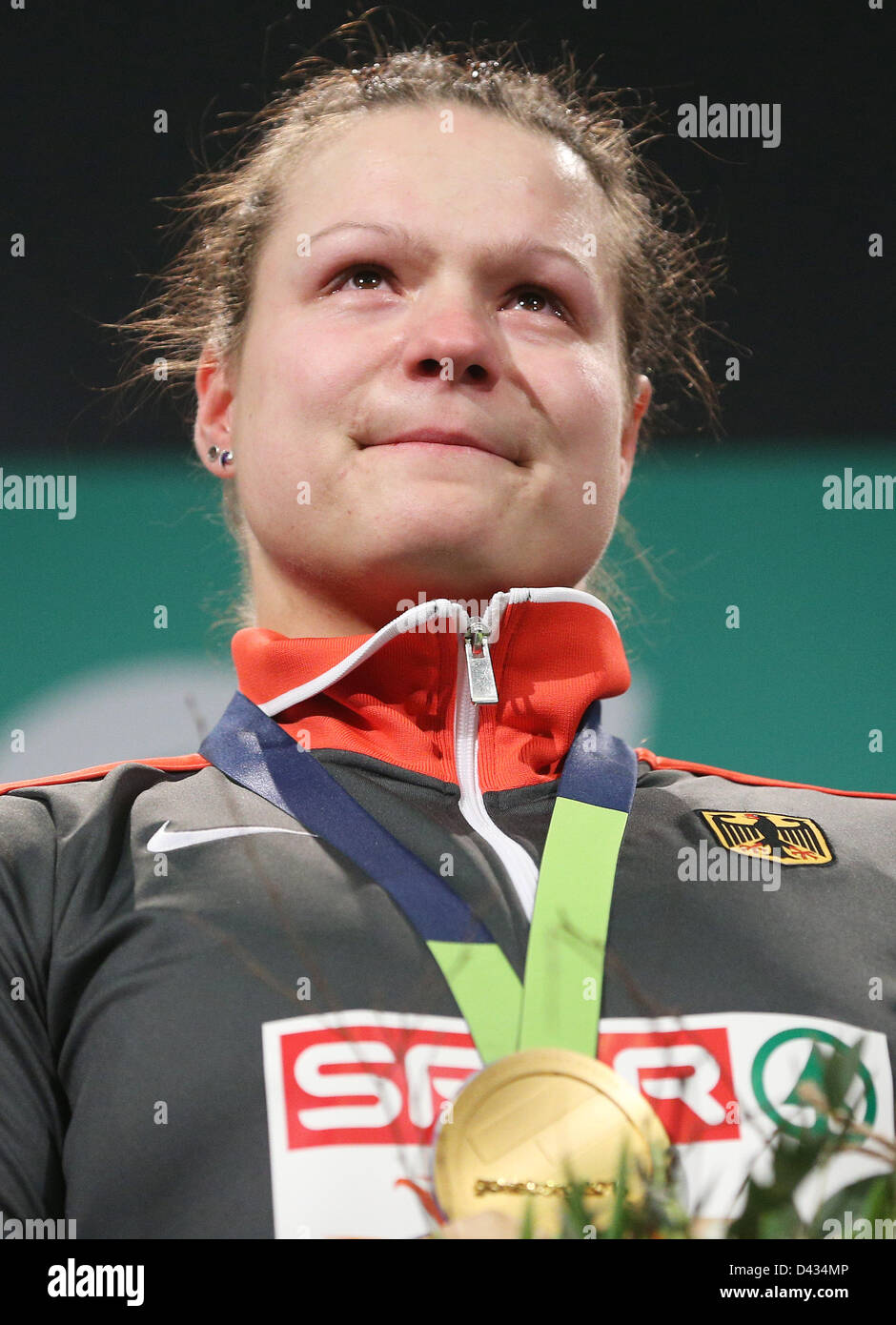 Germany's Christina Schwanitz listens to the national anthem as she ...