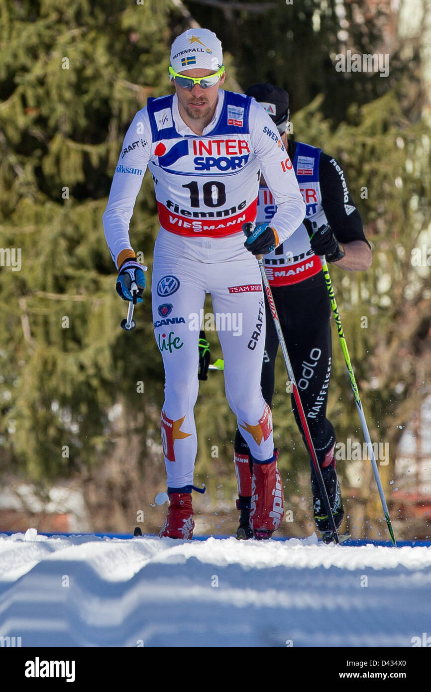 Johan Olsson of Sweden (l) and Dario Cologna of Switzerland compete ...