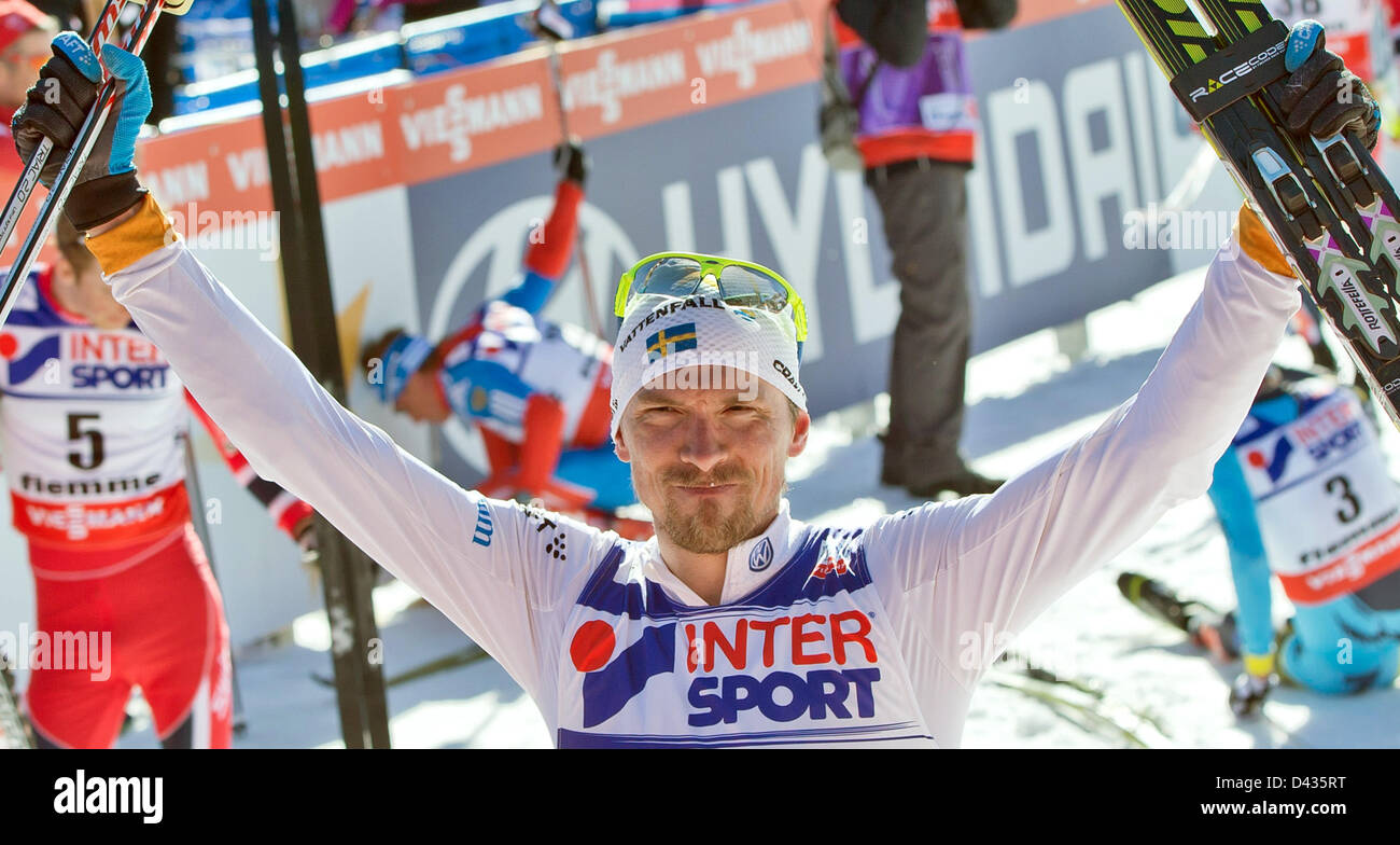 Johan Olsson of Sweden celebrates after winning the men's 50 km mass ...