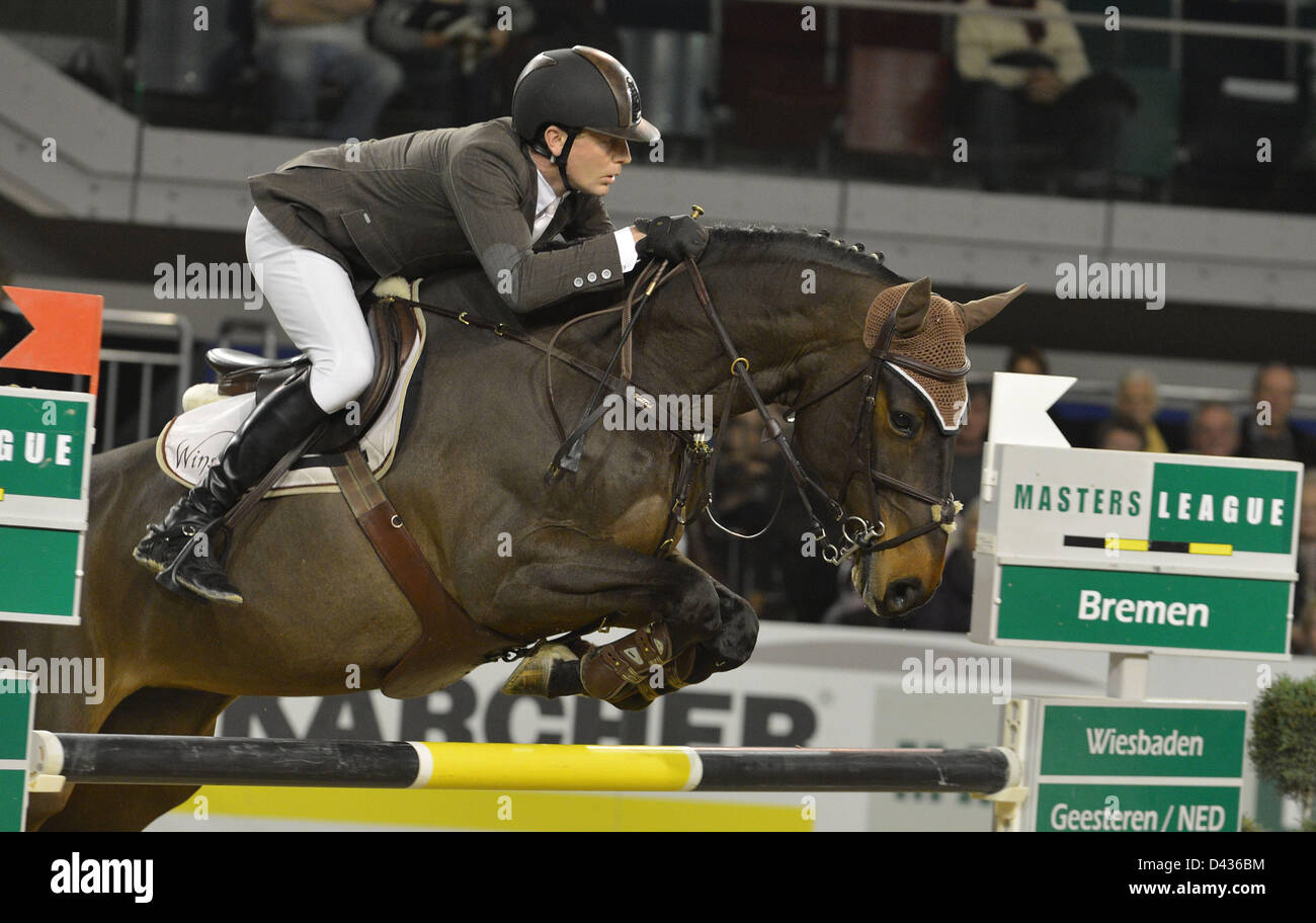 Belgian equestrian Jan Vinckier performs a jump on his horse 'Emilie de ...