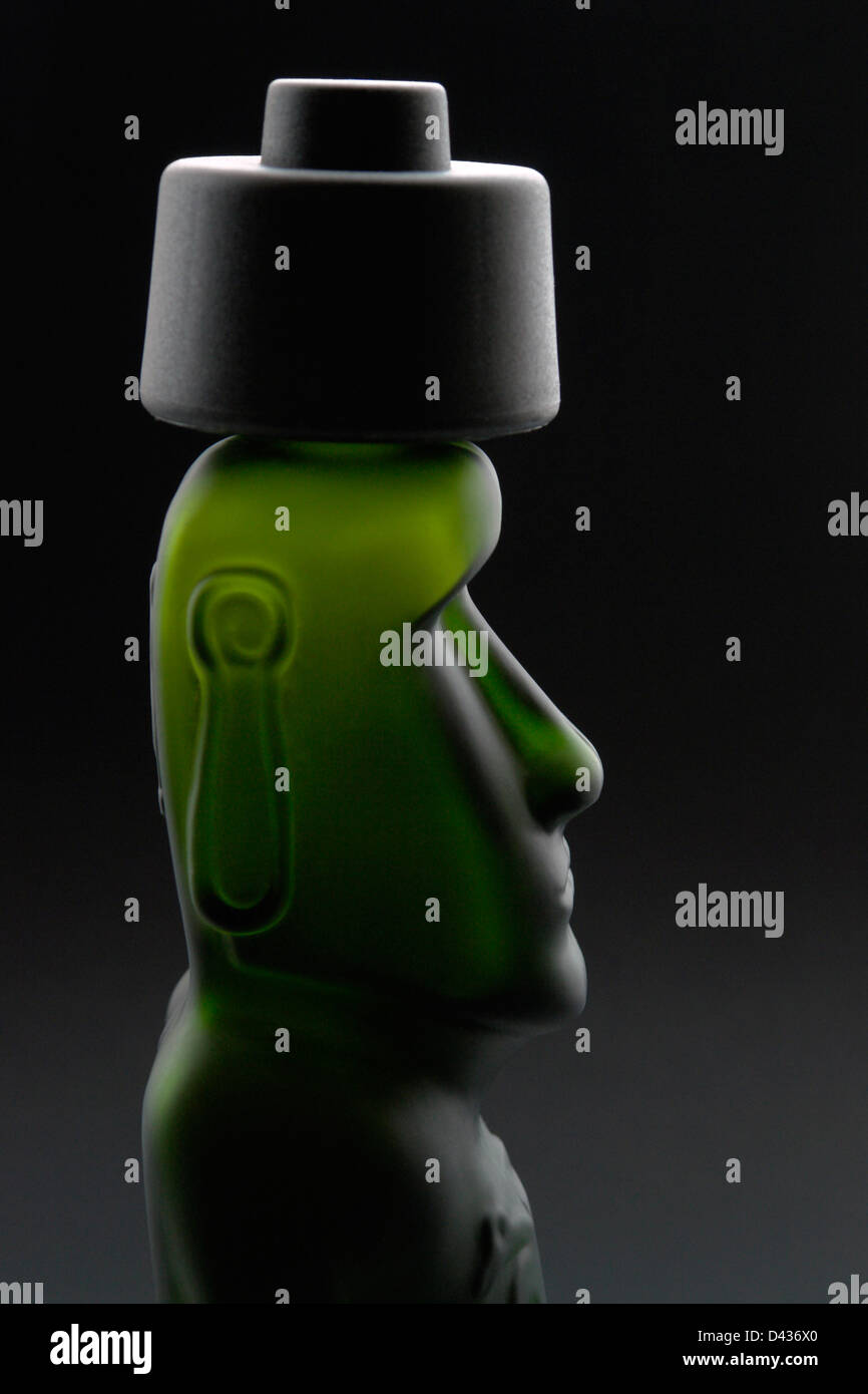 head of a "moai-styled" bottle in dark back Stock Photo - Alamy