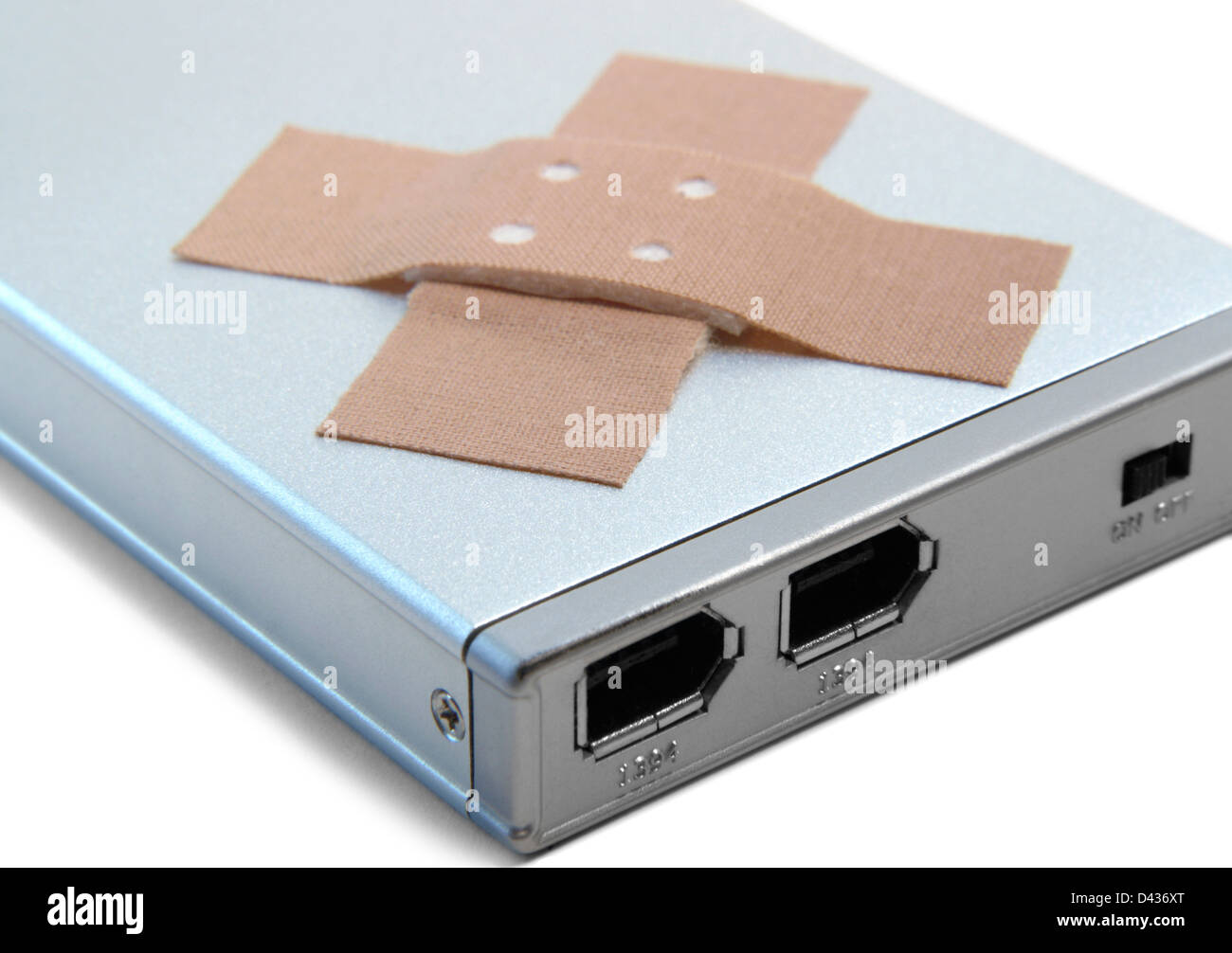 data rescue theme with portable hard disc and crossed band aid on top ...