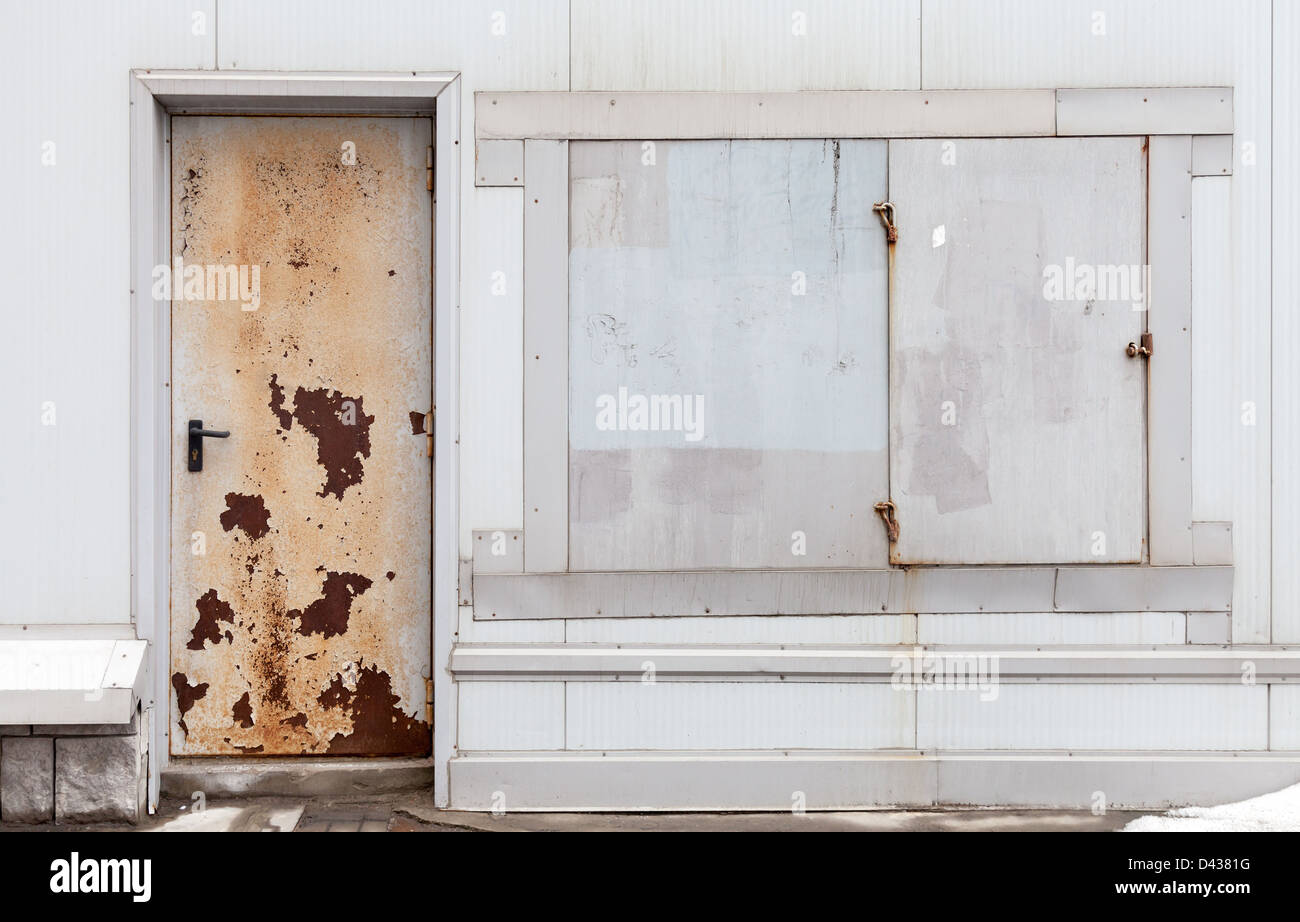 Old rusted locked door and windows background texture Stock Photo - Alamy