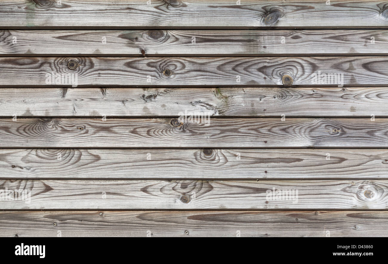 Uncolored weathered gray wooden lining boards Stock Photo - Alamy