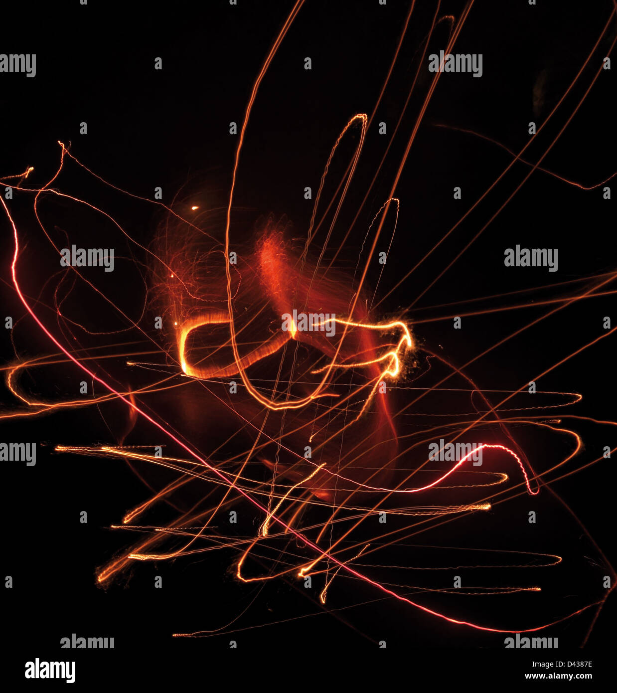 a swinging colorful pyrotechnic effect in dark back Stock Photo - Alamy