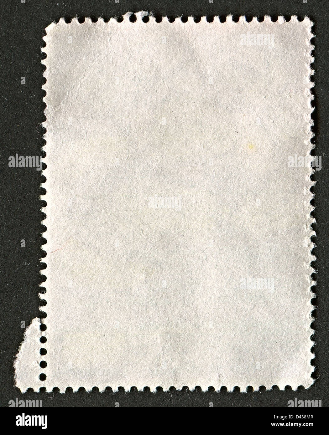 The reverse side of a postage stamp Stock Photo - Alamy