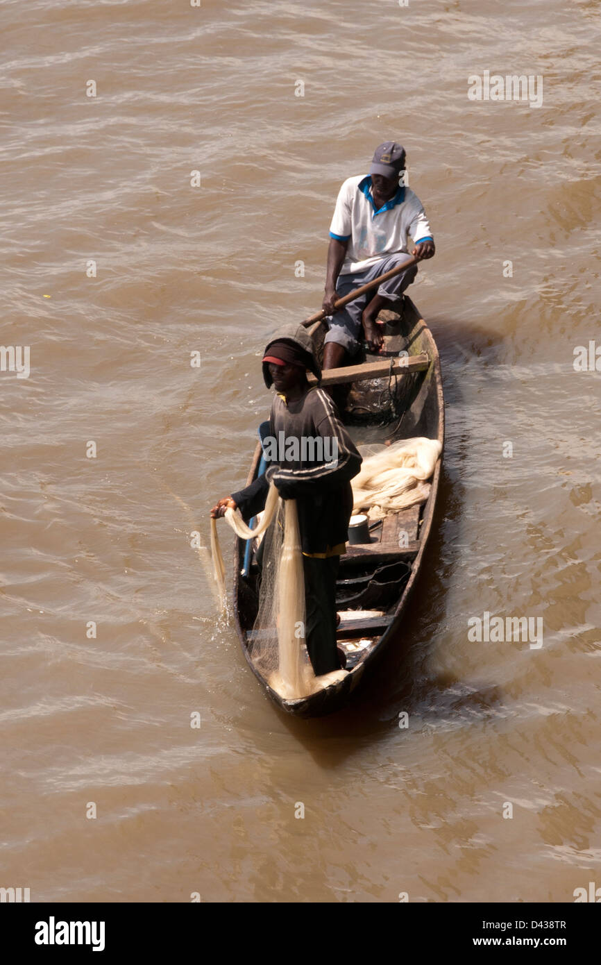 Nigerian fishermen fishing off Lagos in small boat Stock Photo - Alamy