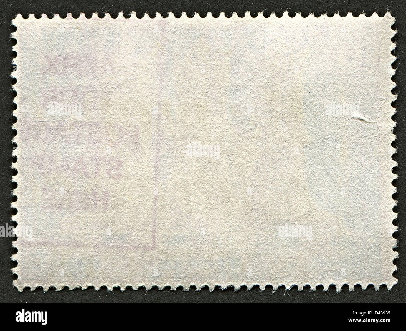 The reverse side of a postage stamp Stock Photo - Alamy