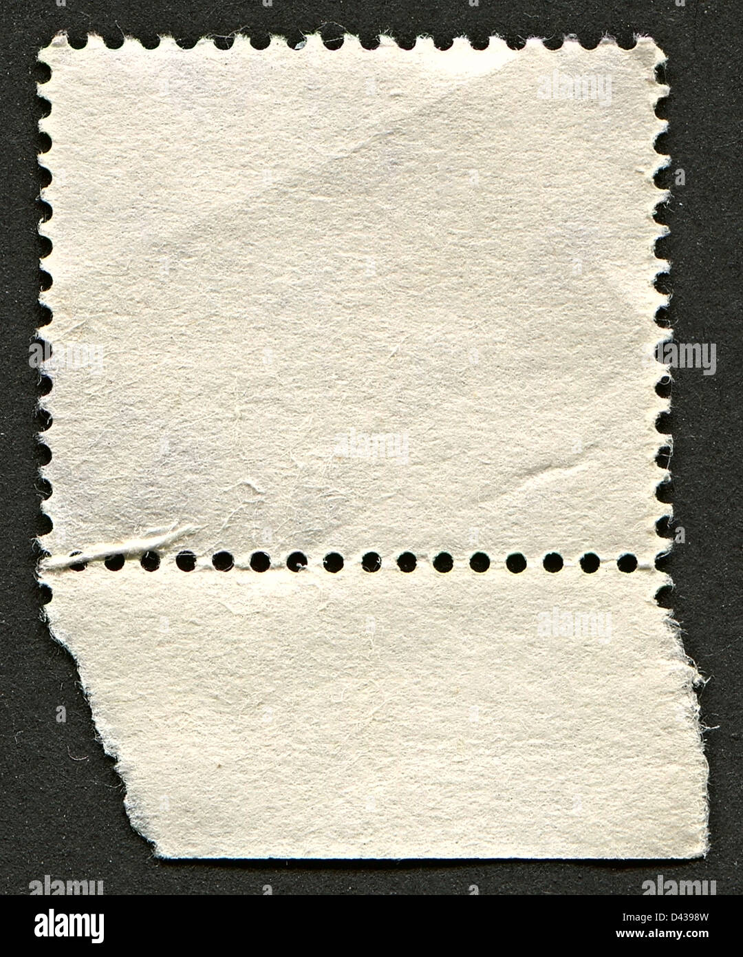 The reverse side of a postage stamp Stock Photo - Alamy
