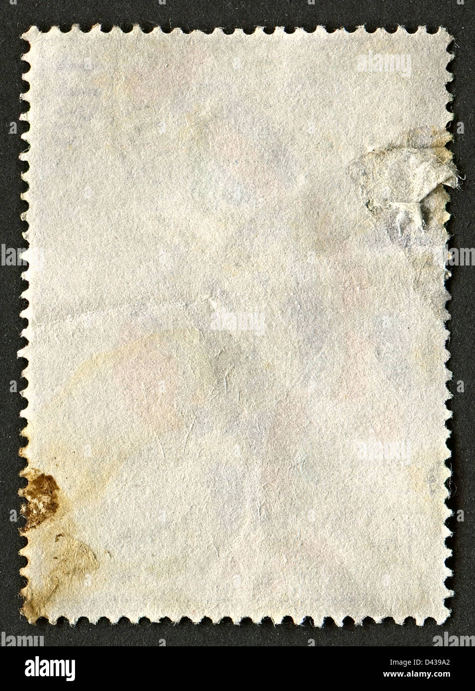 The reverse side of a postage stamp Stock Photo - Alamy