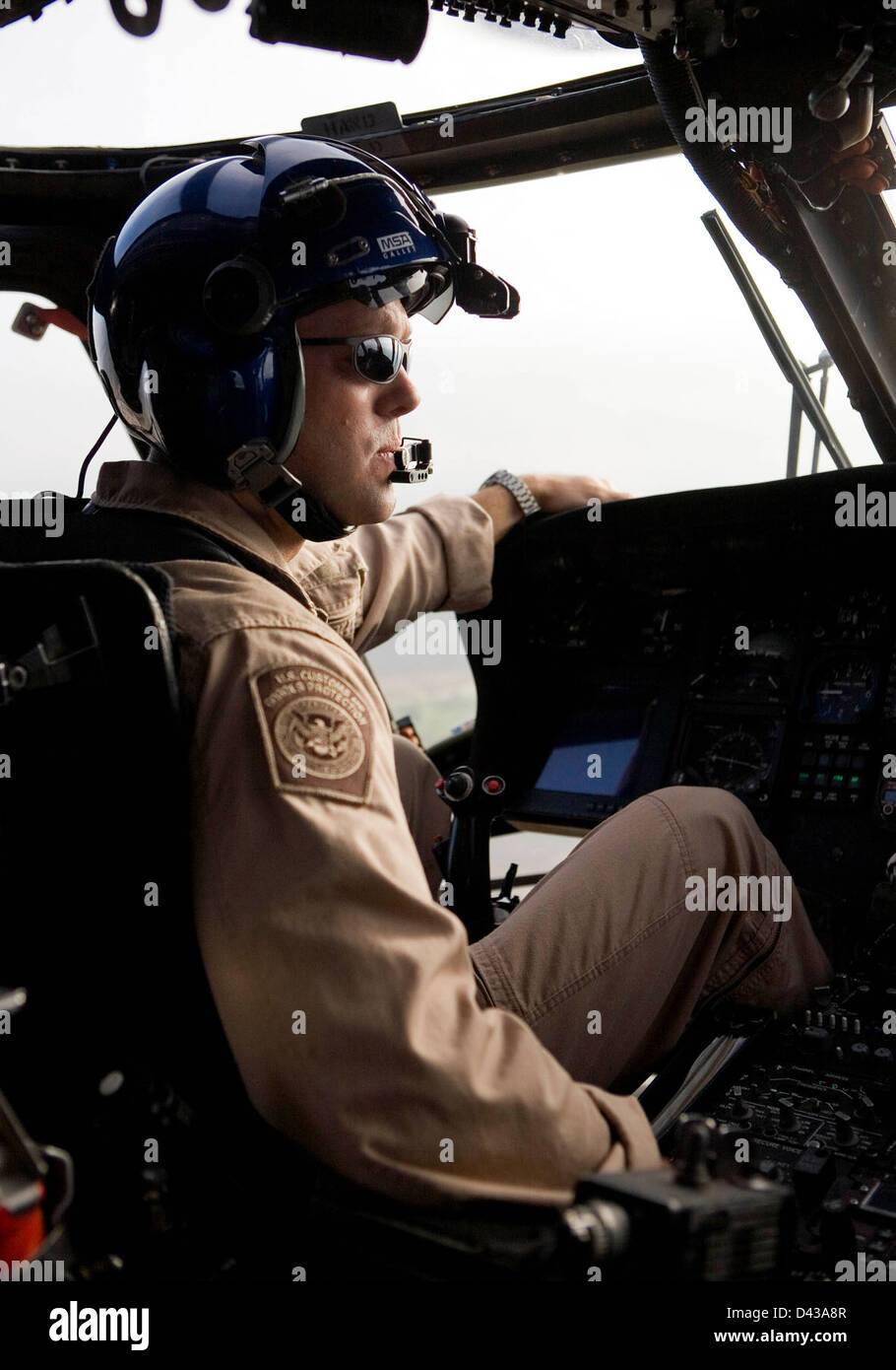 A CBP UH-60 Blackhawk pilot flies over the southern border, monitoring ...