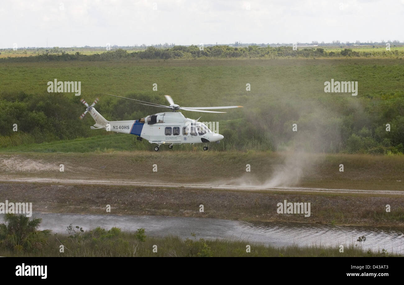 The image shows U.S. Customs and Border Protection aircraft and marine ...