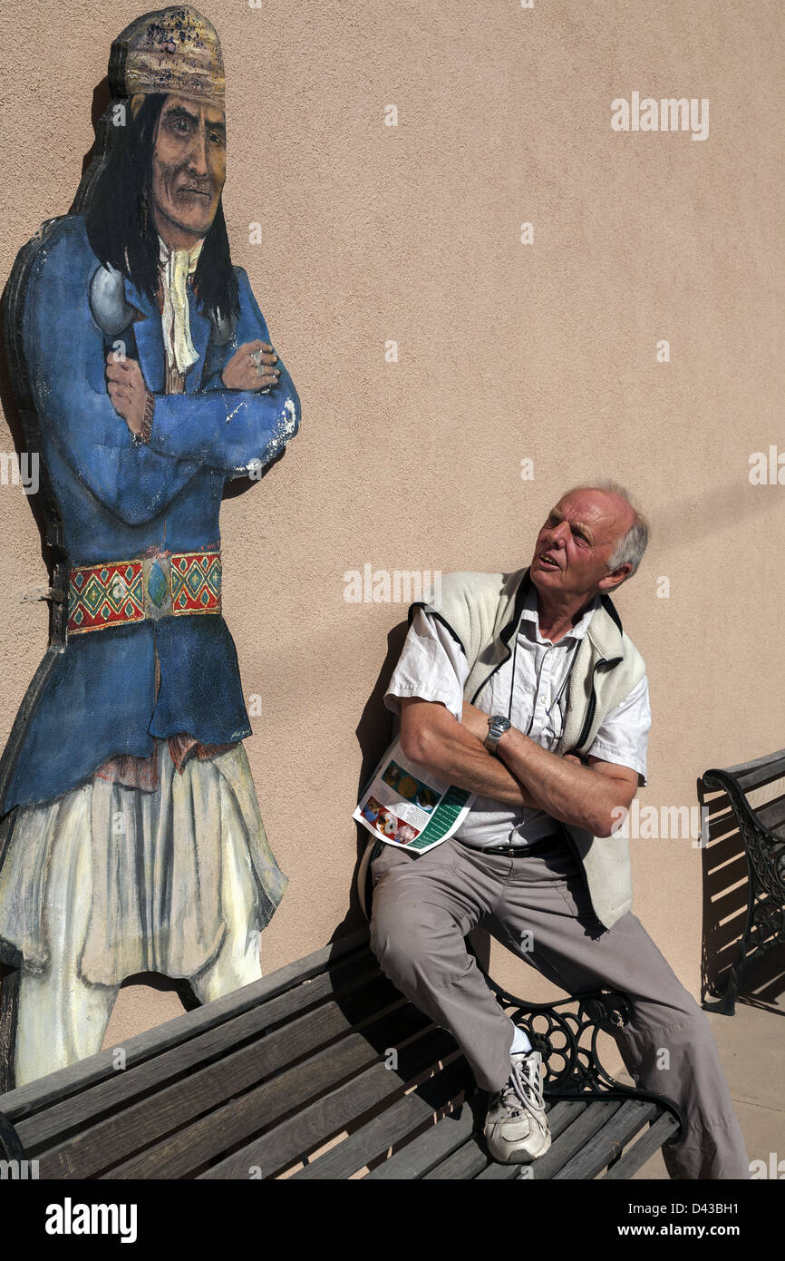 Man looking up at a painting of Geronimo at the Geronimo Springs Museum ...