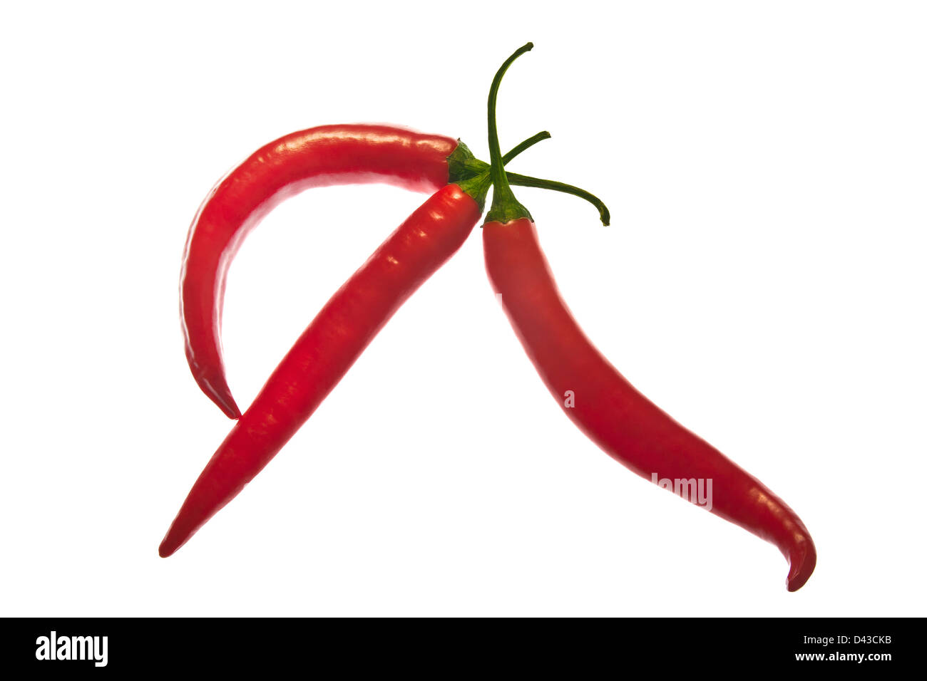 Three red chili peppers on white background Stock Photo - Alamy