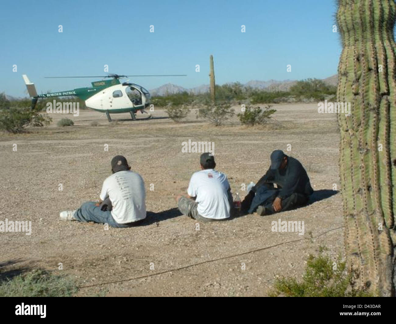 This image features a federal law enforcement agency operation, with ...