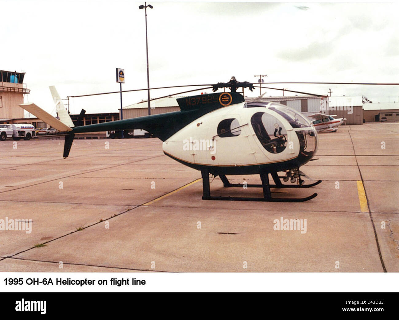 This image shows a U.S. Customs and Border Protection OH-6 helicopter ...