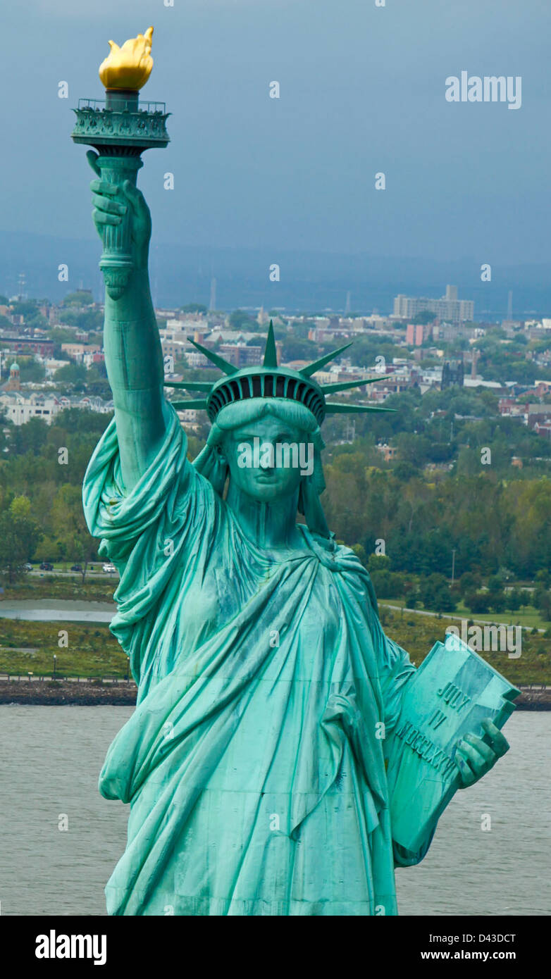 The Statue of Liberty, a symbol of freedom and democracy, is closely ...
