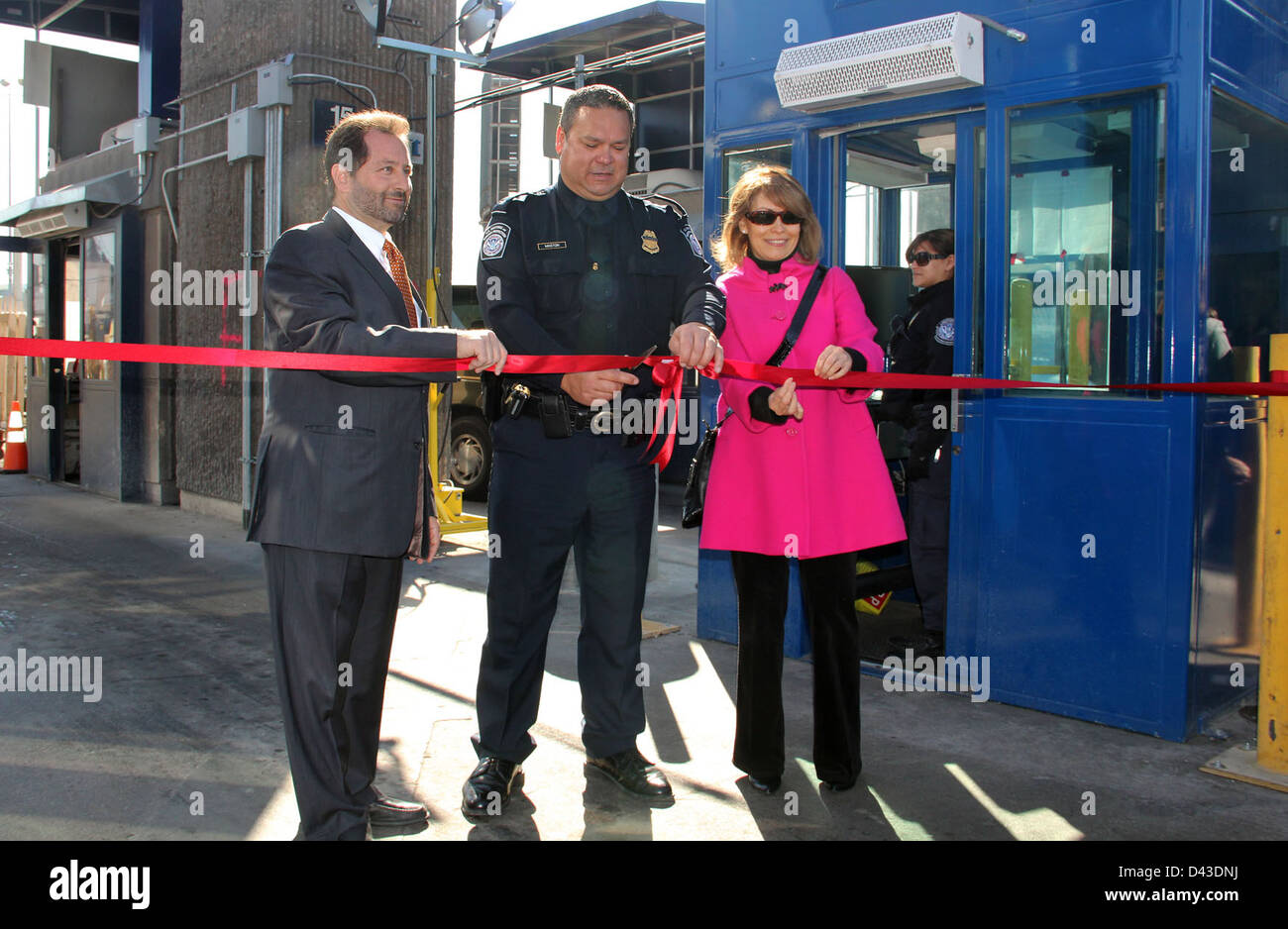 This photograph captures the ribbon-cutting ceremony for the Ready Lane ...