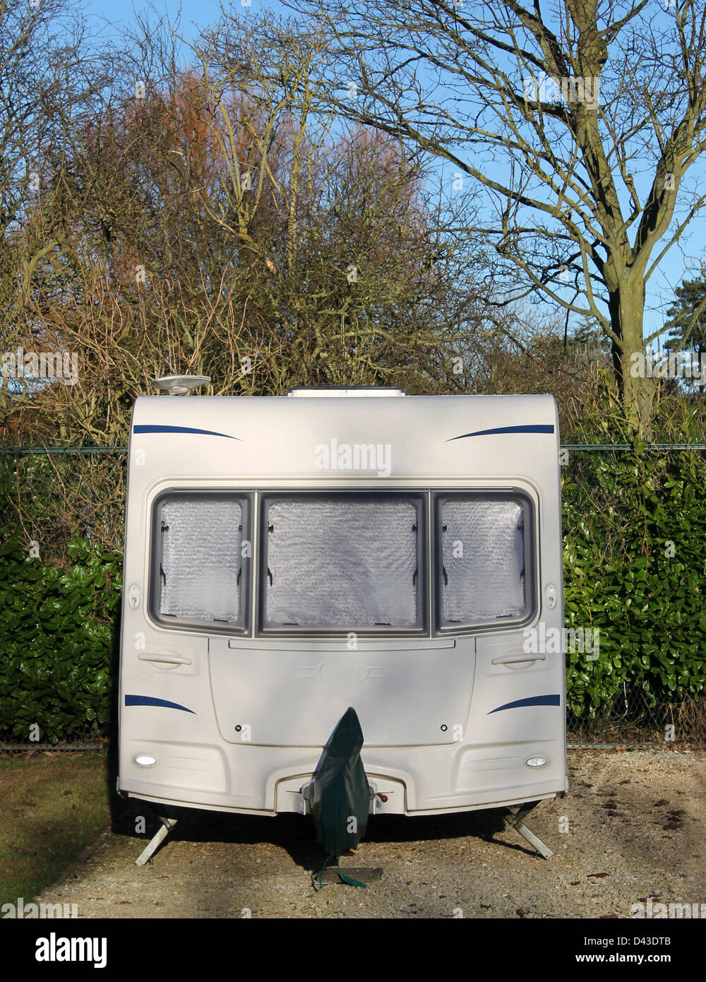 Front view of white caravan in the countryside Stock Photo - Alamy