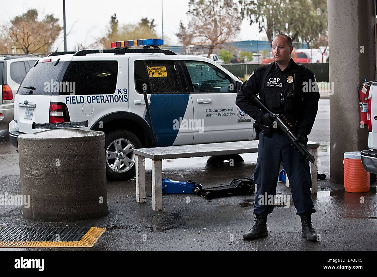 U.S. Customs and Border Protection officers conduct vehicle inspections ...