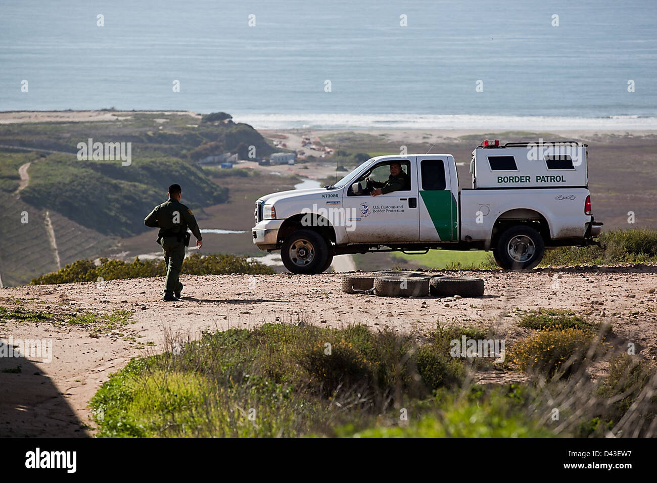 A photograph showcasing U.S. Border Patrol officers and immigration ...