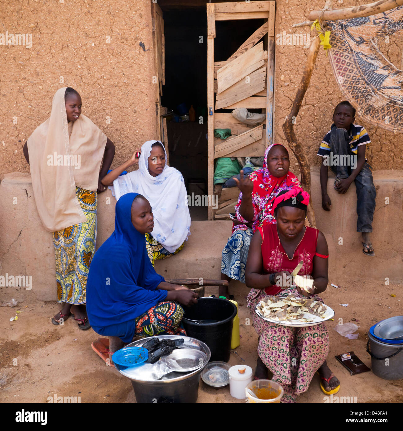 Women sell food outside their house in Agadez Stock Photo - Alamy