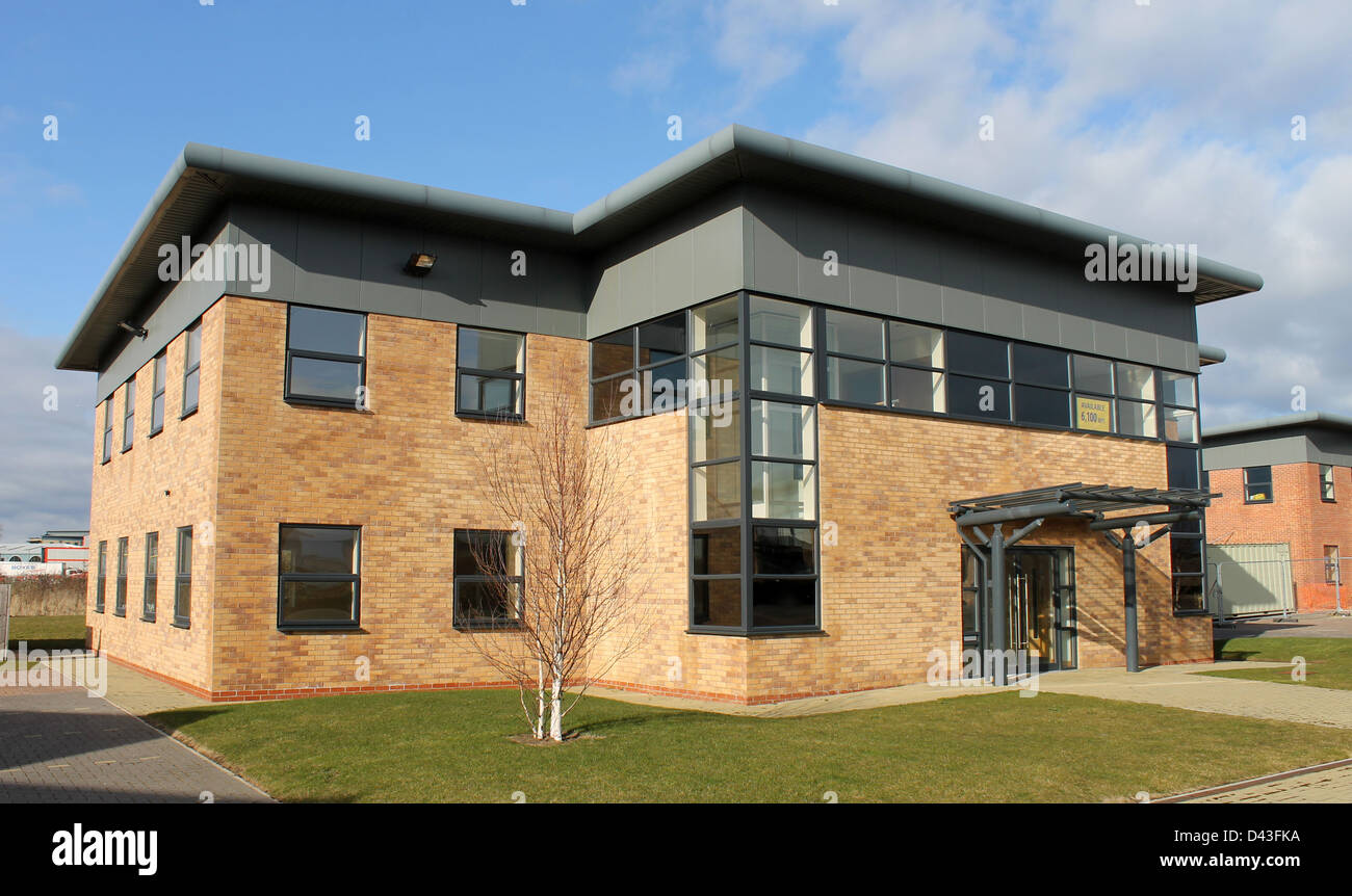 Exterior of spacious modern office building to let with sign. Empty ...