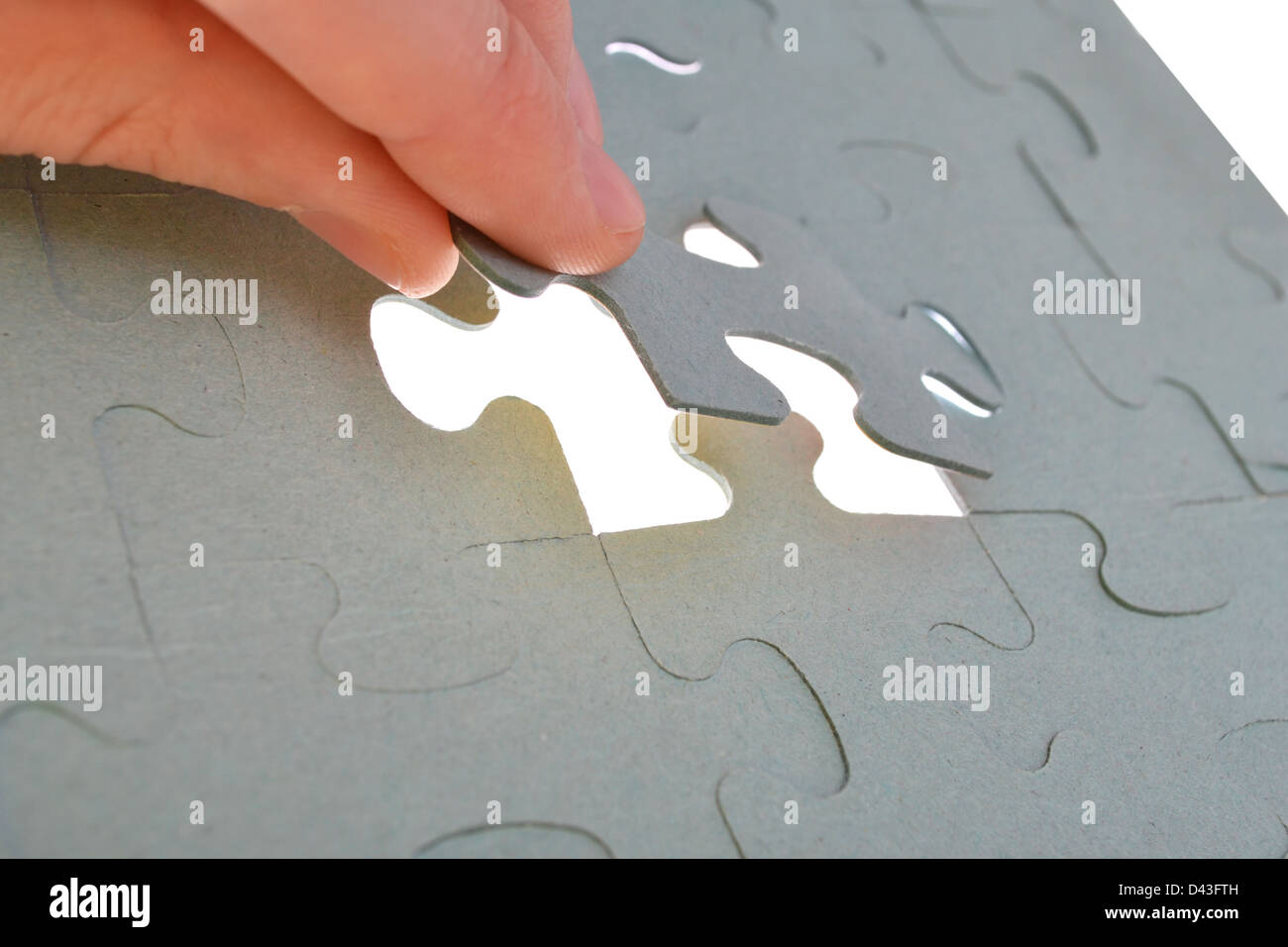 Hands placing last piece of a Stock Photo - Alamy