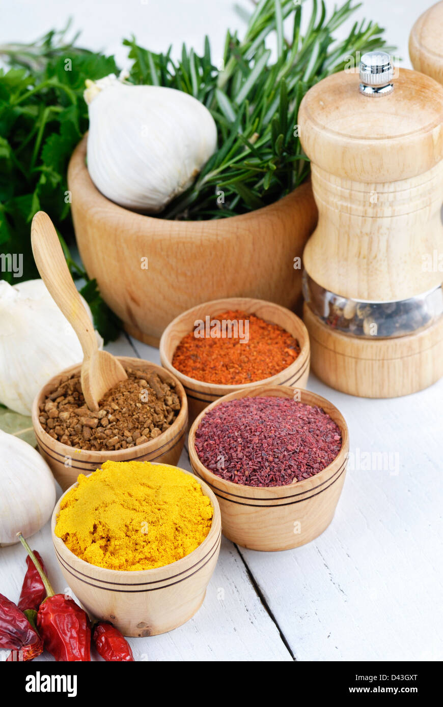 Different kinds of seasonings and herbs on the white oak table Stock ...