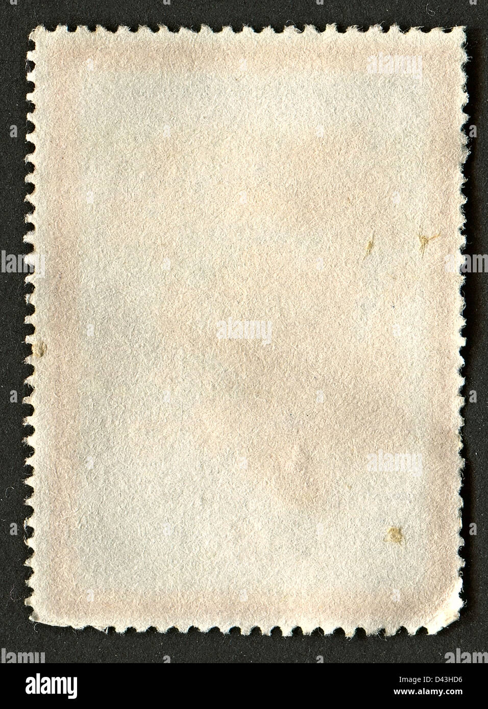 The reverse side of a postage stamp Stock Photo - Alamy