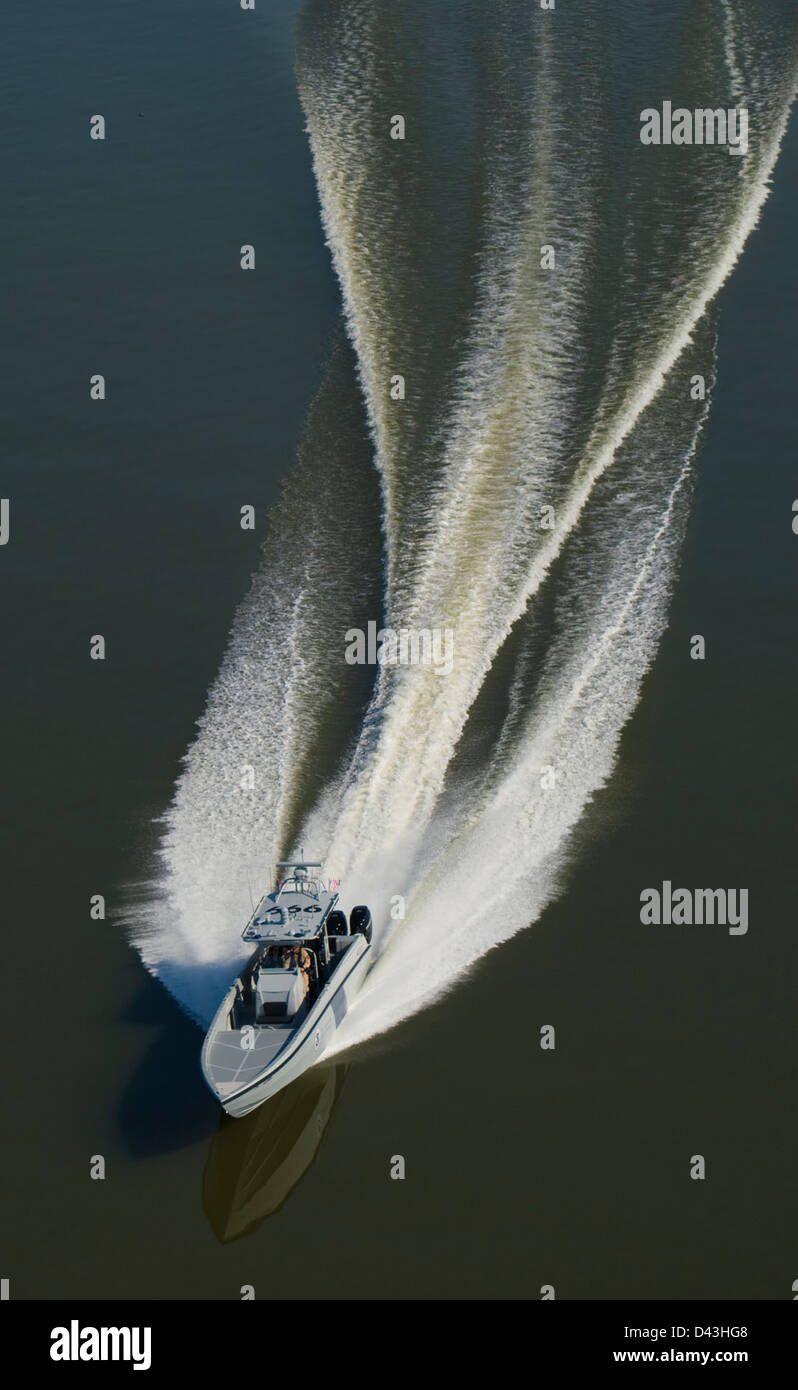 A CBP helicopter, an AStar model, is seen in flight as part of border ...